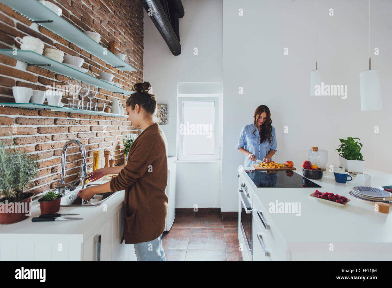Caucasian women cooking in kitchen Stock Photo - Alamy