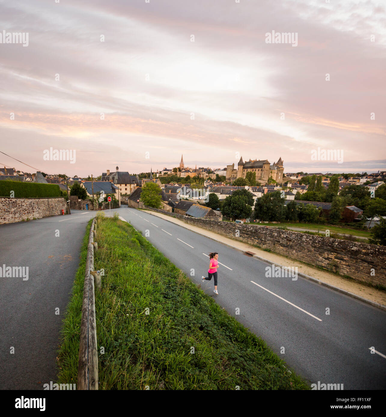Woman running on countryside road hi-res stock photography and images ...