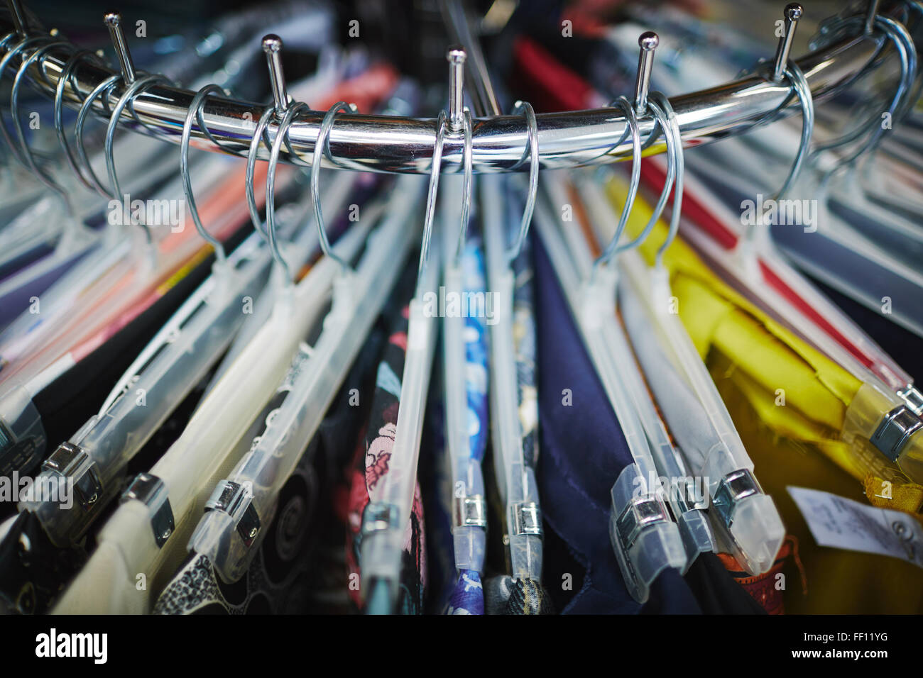 Samples of textiles on hangers in tailoring-shop Stock Photo - Alamy
