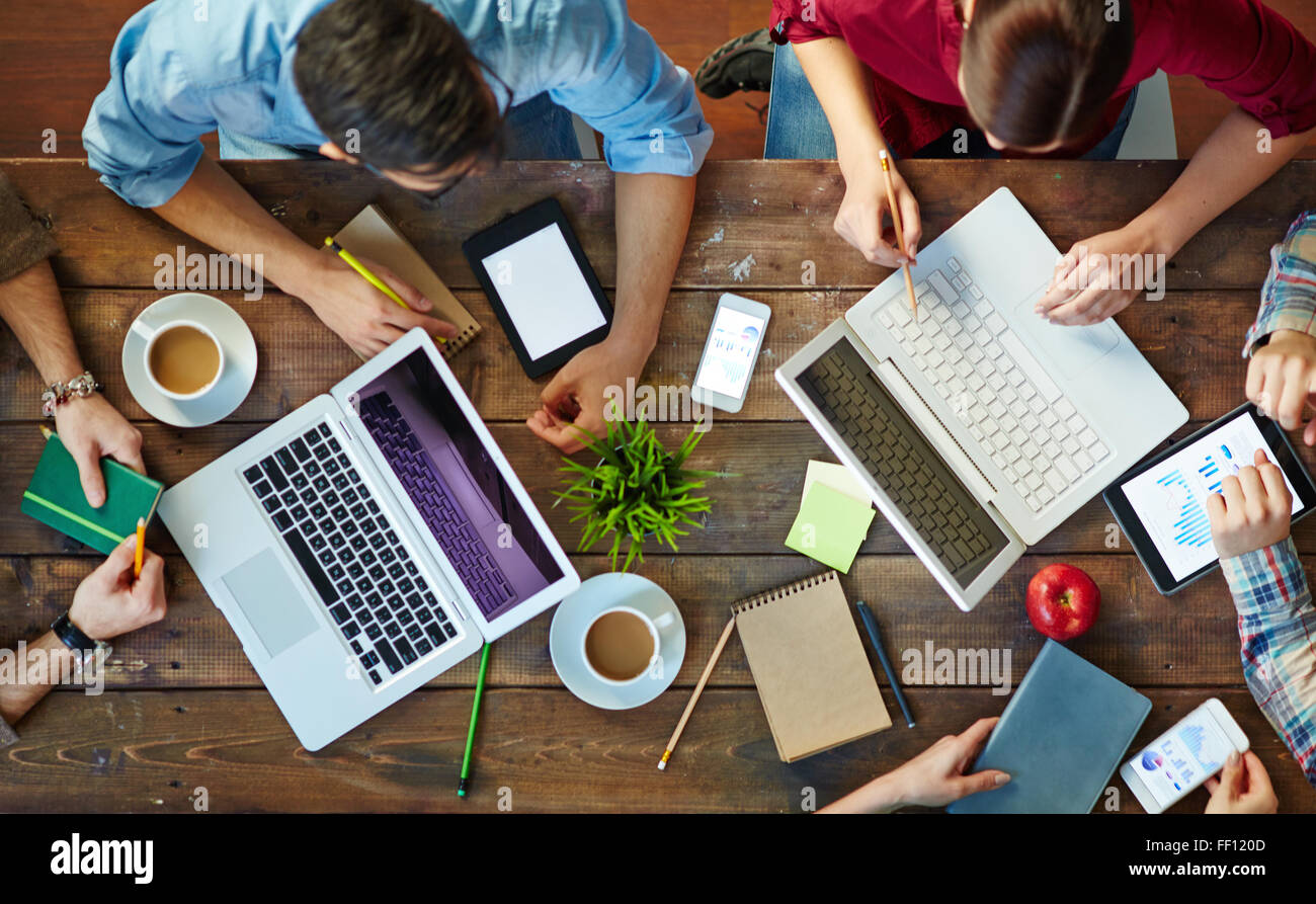 Business people having meeting by table Stock Photo - Alamy