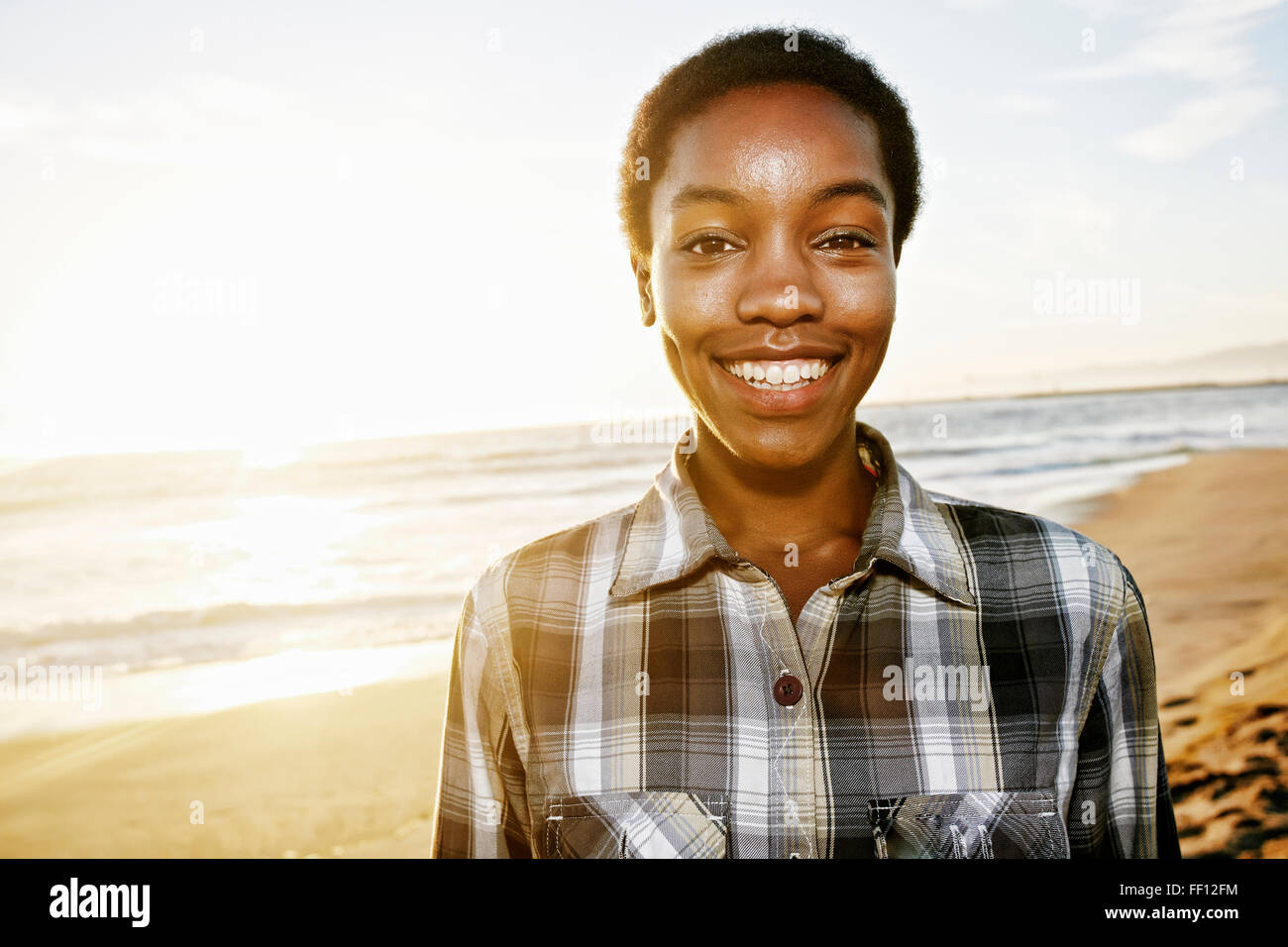 Woman smiling on beach hi-res stock photography and images - Alamy