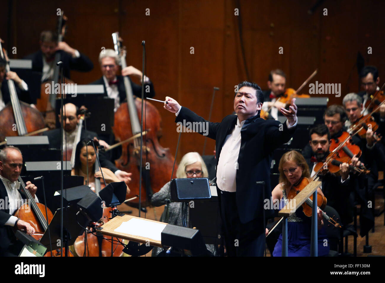 New York, USA. 9th Feb, 2016. Maestro Yu Long(front) conducts Spring ...