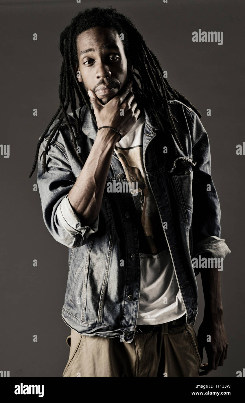 Black man scratching his chin Stock Photo - Alamy