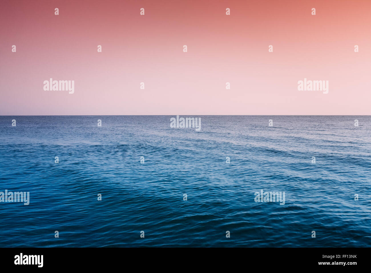 Calm Sea Ocean And Red Clear Sunset Sunrise Sky Background Stock Photo ...