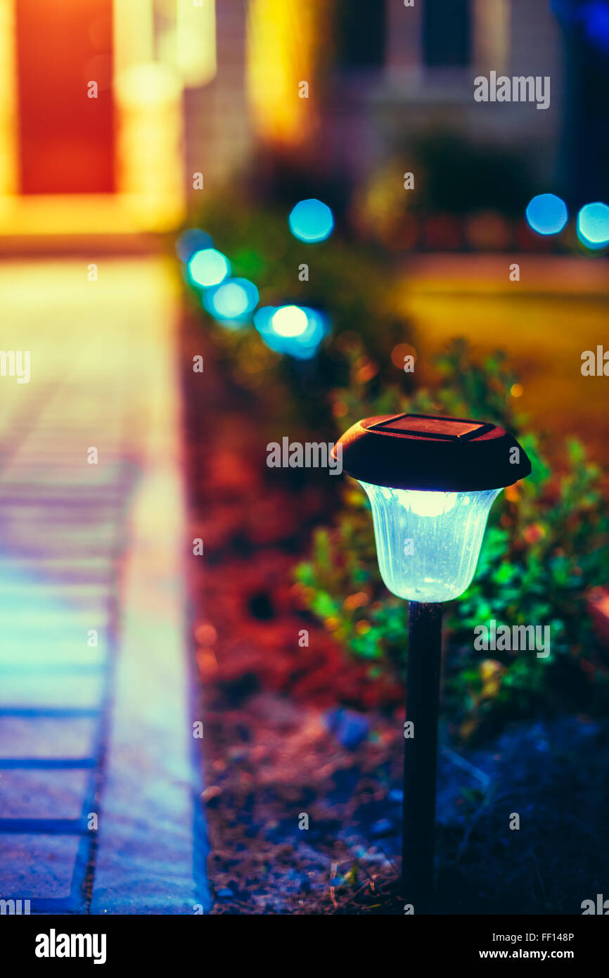 Small Solar Garden Light, Lanterns In Flower Bed. Garden Design. Solar ...