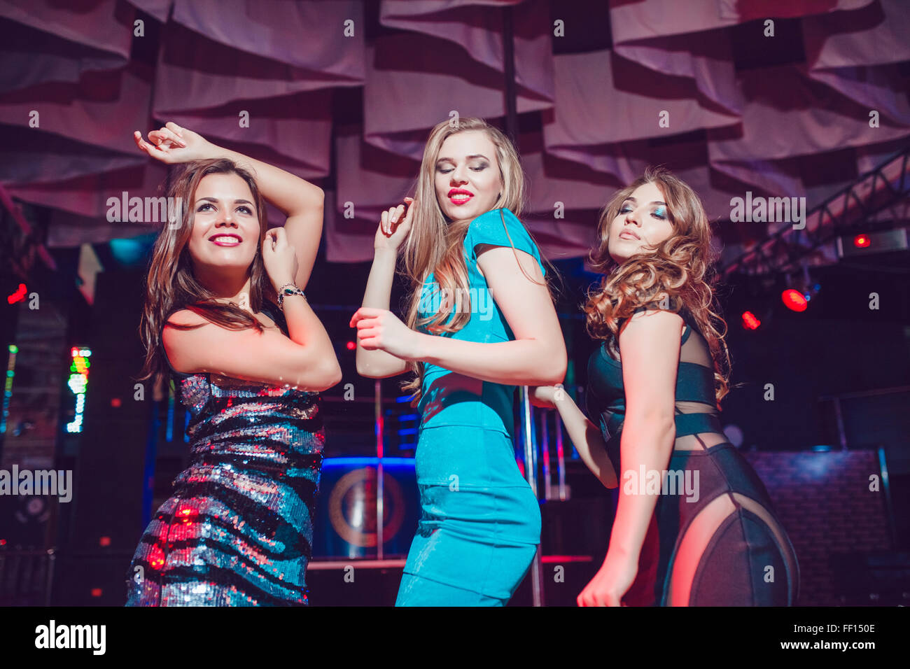 Beautiful girls having fun at a party in nightclub Stock Photo - Alamy