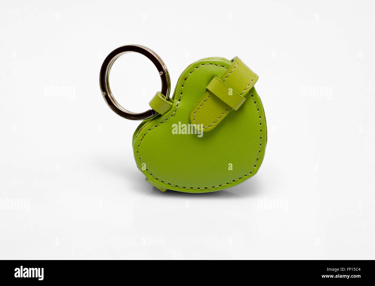 Green leather trinket isolated on white Stock Photo - Alamy
