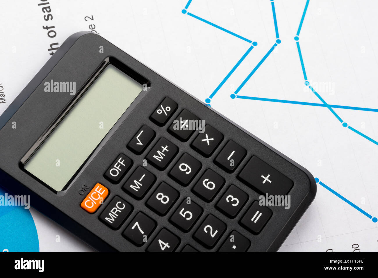 Financial graphs and charts analysis with calculator Stock Photo - Alamy