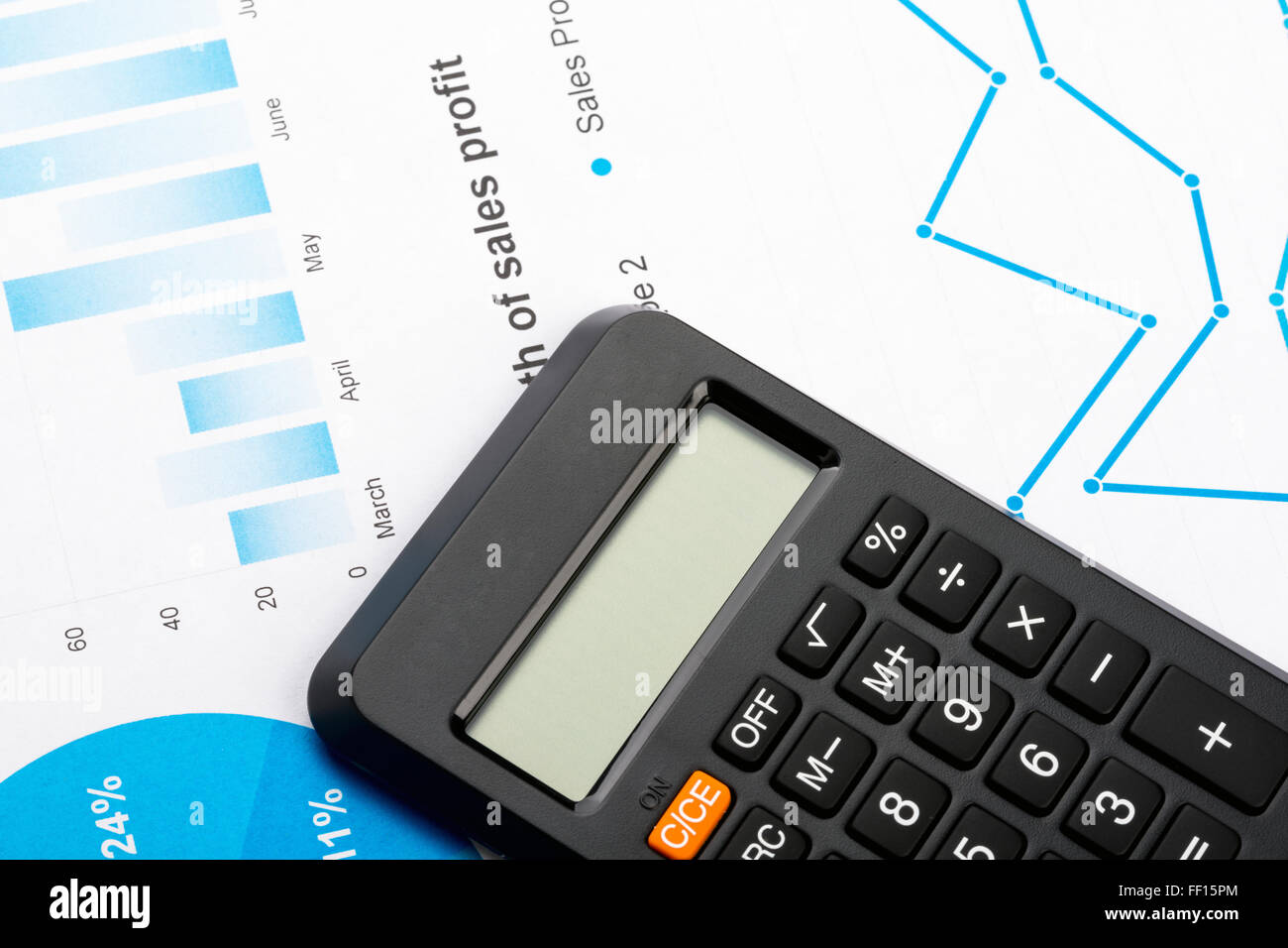 Financial graphs and charts analysis with calculator Stock Photo - Alamy