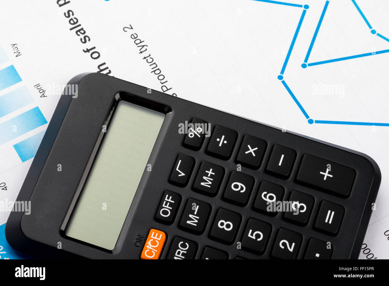 Financial graphs and charts analysis with calculator Stock Photo - Alamy