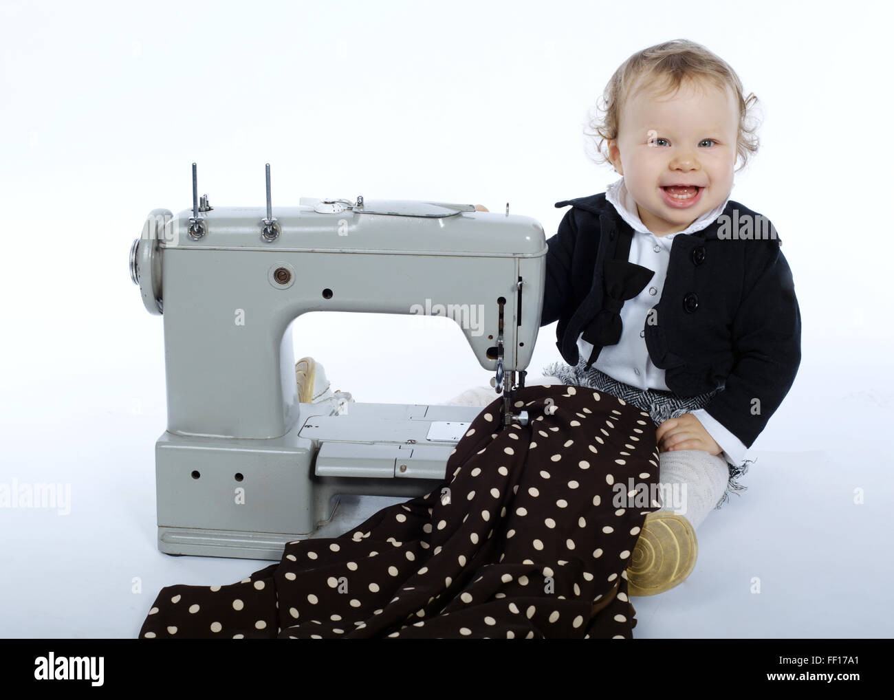 photo of little girl with sewing machine Stock Photo - Alamy