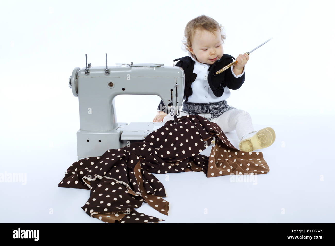 photo of little girl with sewing machine Stock Photo - Alamy