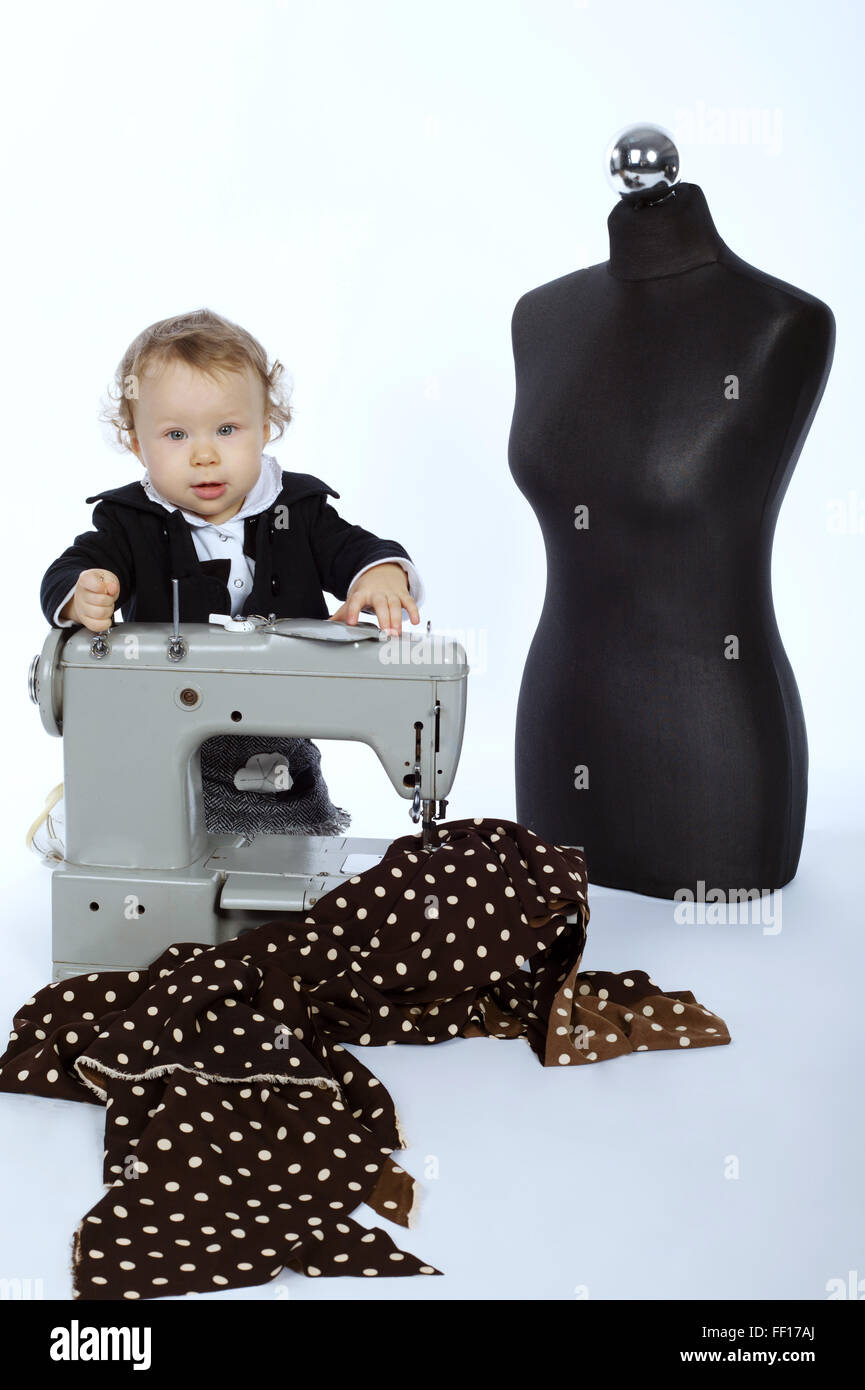 photo of little girl with sewing machine Stock Photo - Alamy