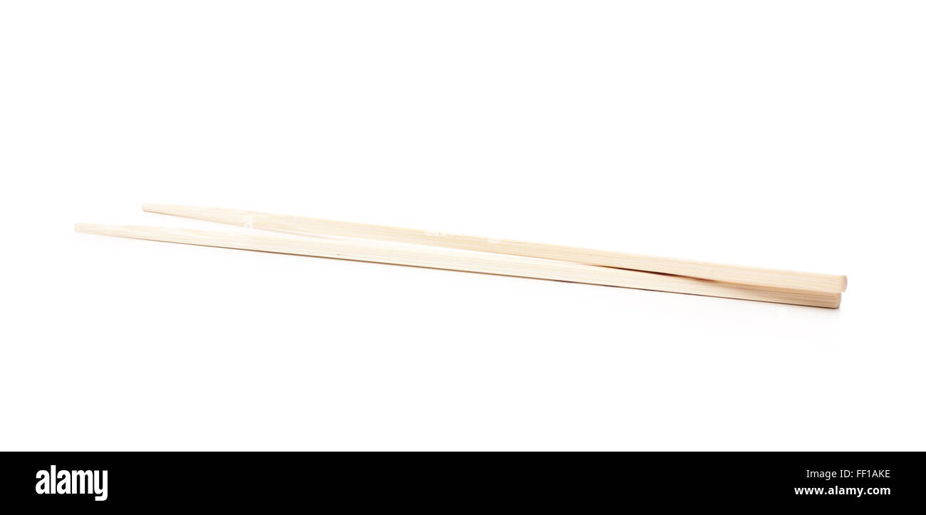Standard asian chopsticks on white background Stock Photo - Alamy