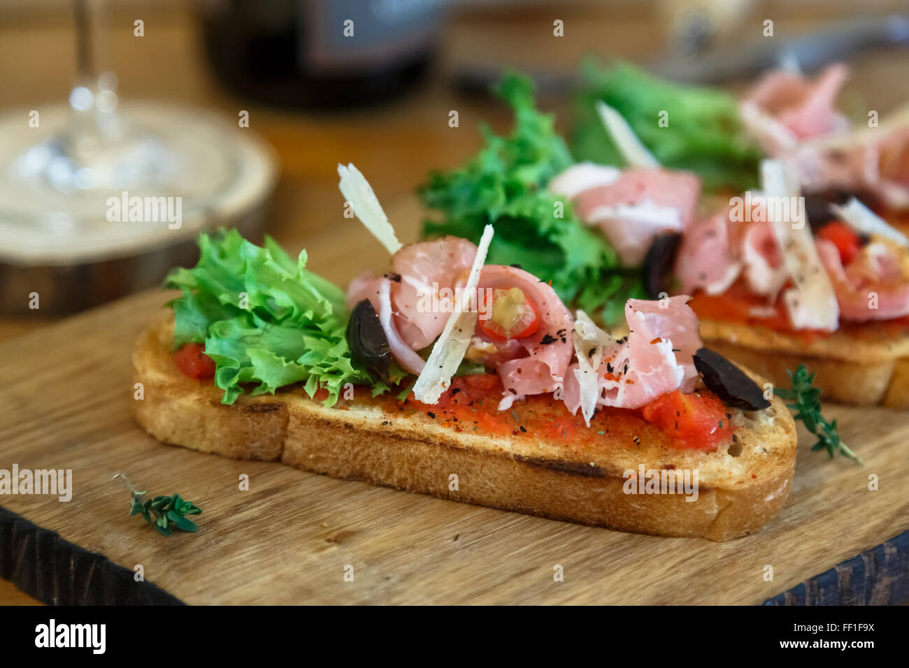 Tapas on Crusty Bread - Selection of Spanish tapas served with a sliced ...
