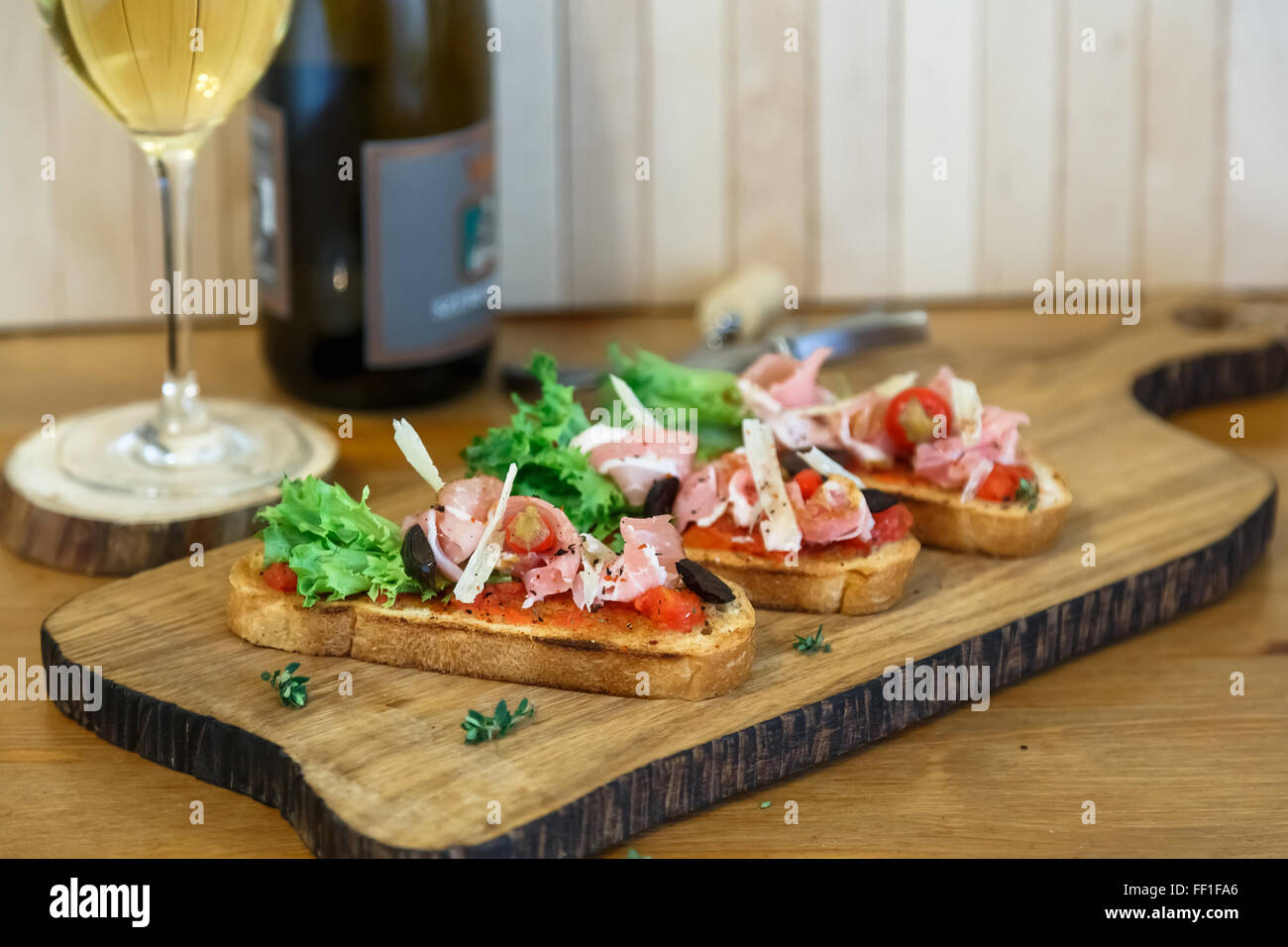 Tapas on Crusty Bread - Selection of Spanish tapas served with a sliced ...