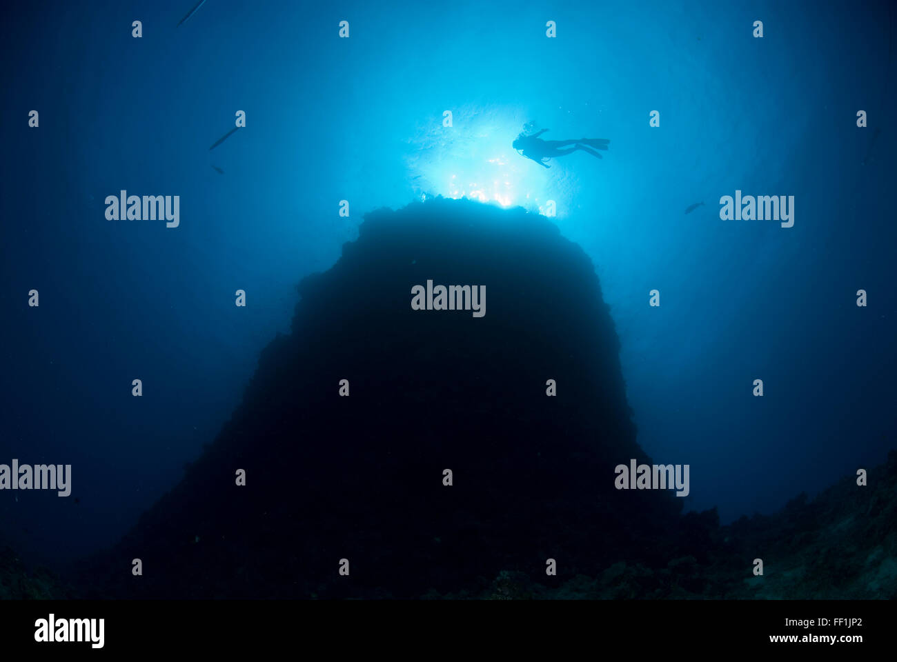 Pixie's Pinnacle silhouette with diver Stock Photo - Alamy