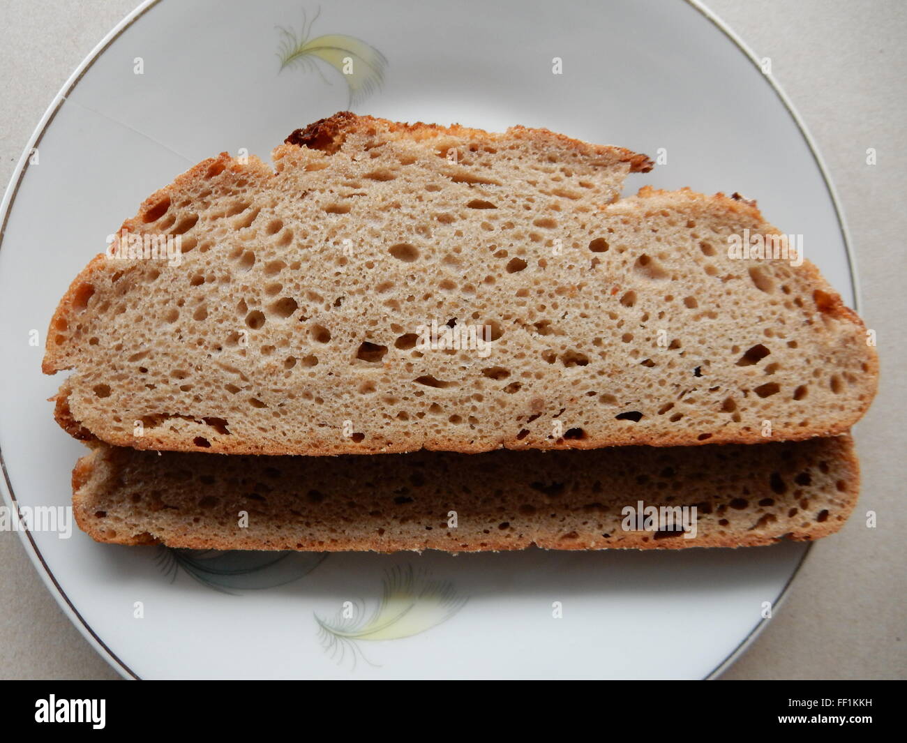 two pieces of bread on a plate Stock Photo - Alamy