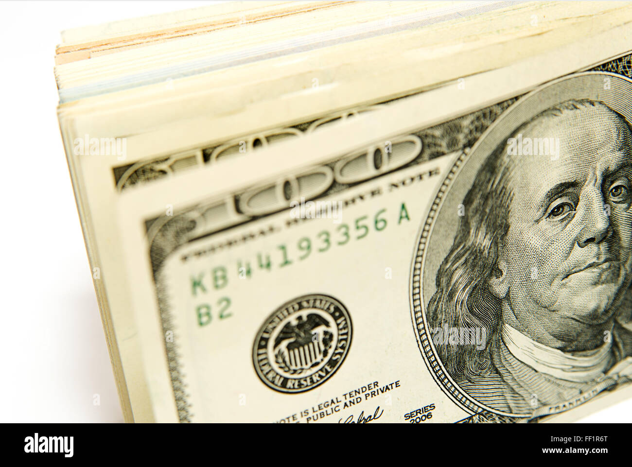 One pack of dollars on over white Stock Photo - Alamy