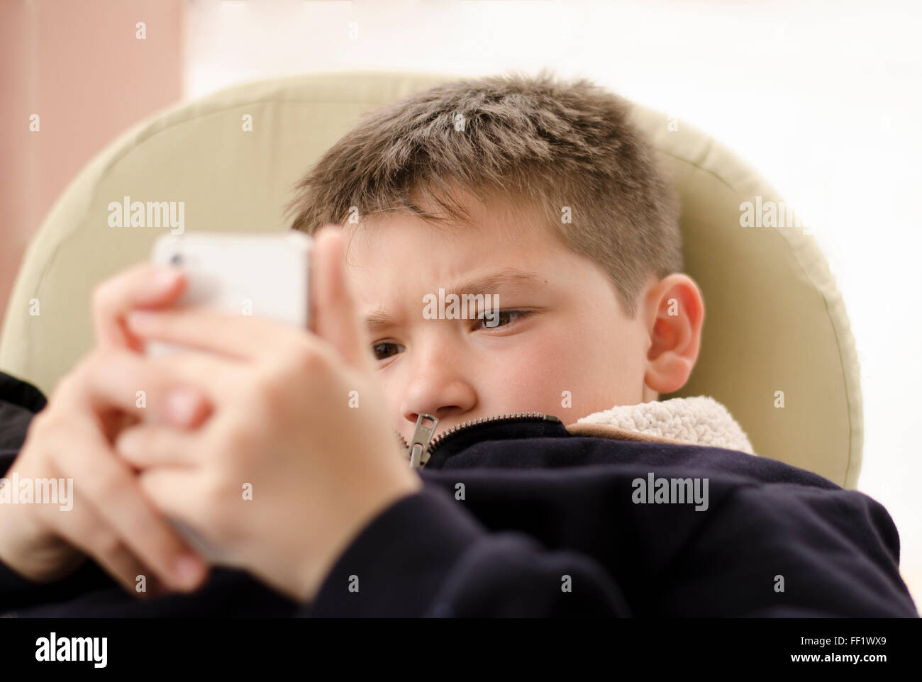 Boy kid child playing with mobile phone Stock Photo - Alamy
