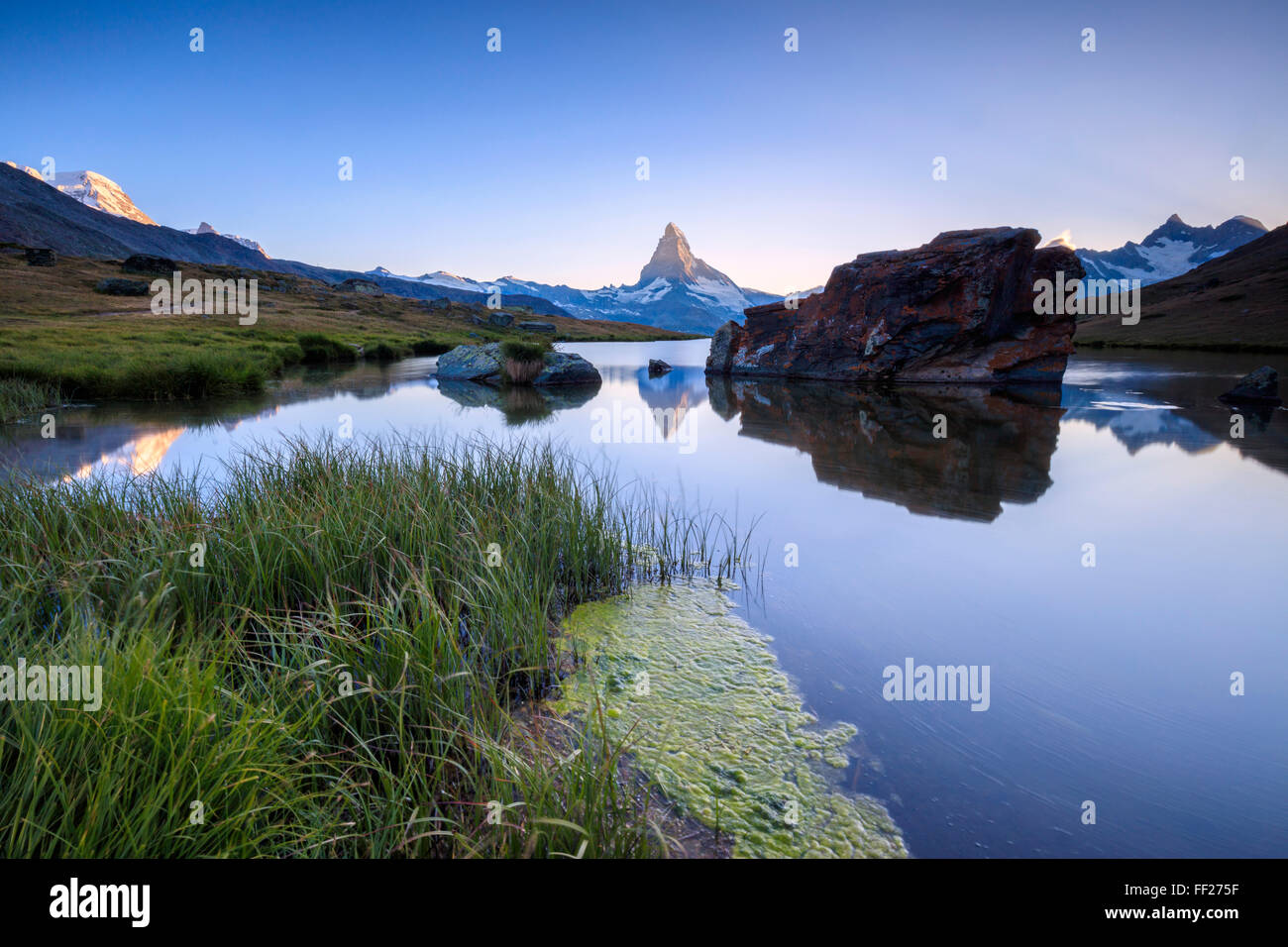 The Matterhorn reflected in Lake Stellisee at dawn, Zermatt, Canton of ...
