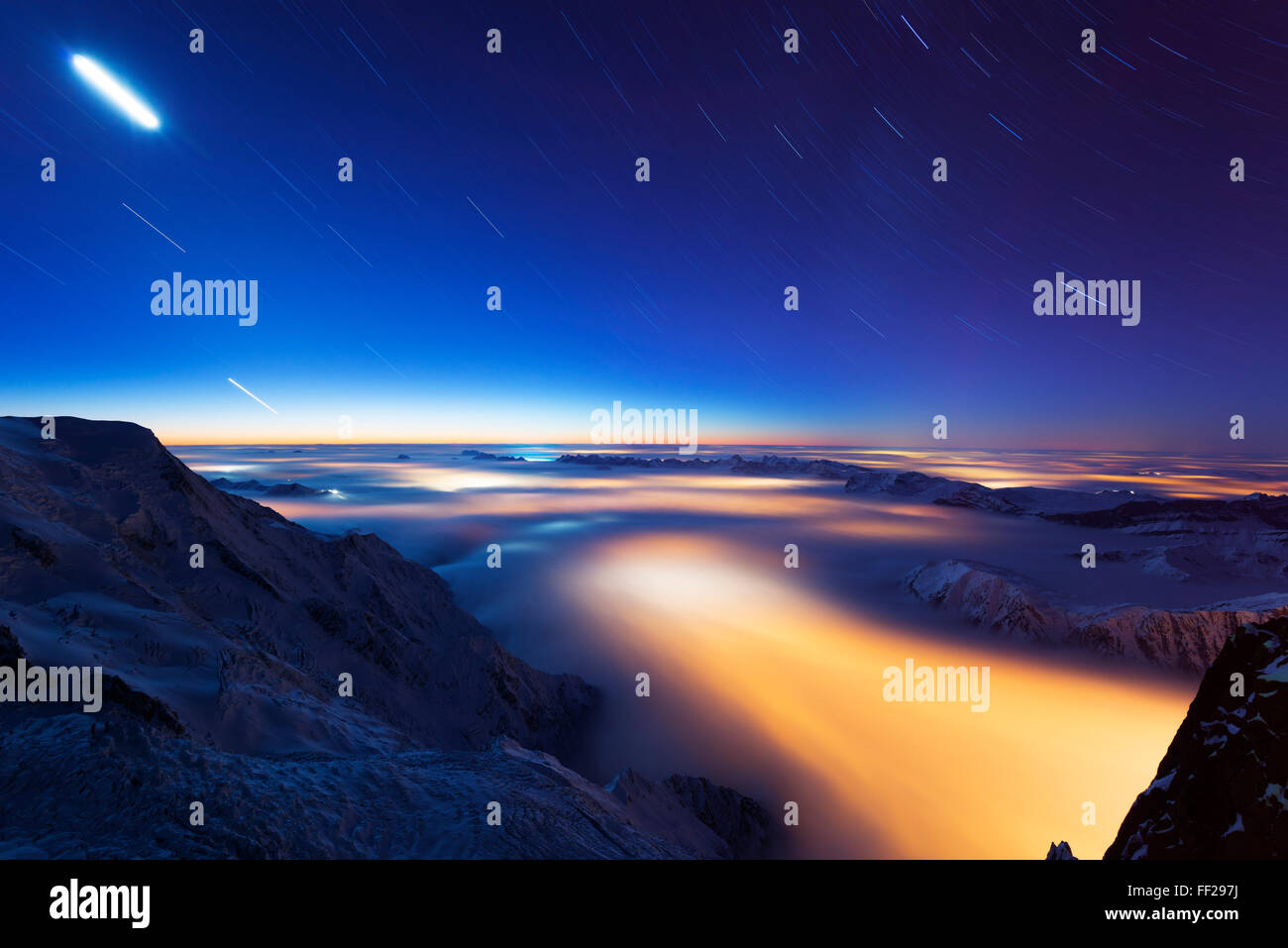 Sea of clouds weather inversion over Chamonix valley, star and moon ...