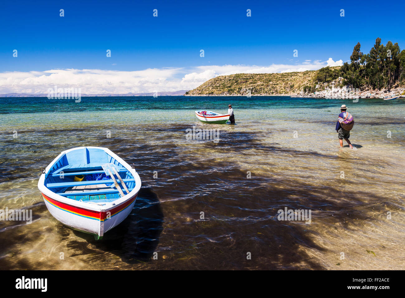 ViRMRMagers going fishing on RMake Titicaca at ChaRMRMapampa viRMRMage ...