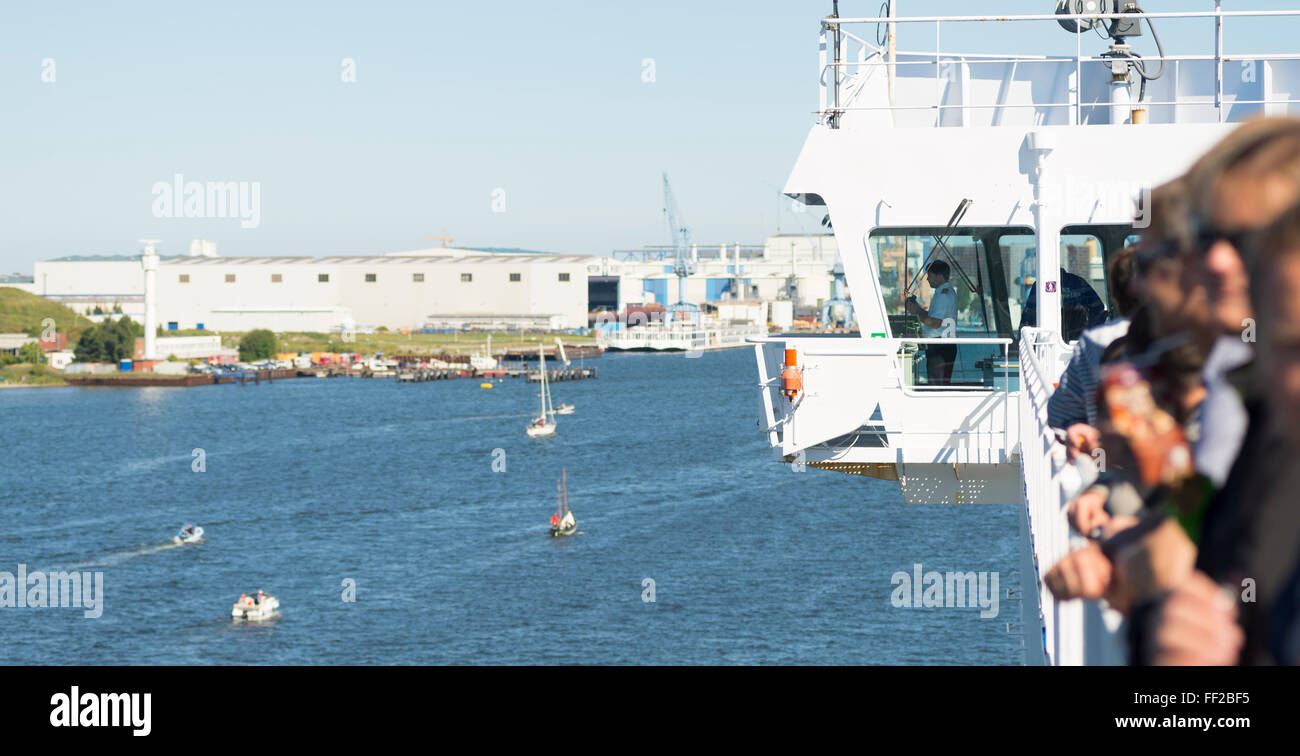 Captain on the command bridge of a ferry observing the traffic while ...