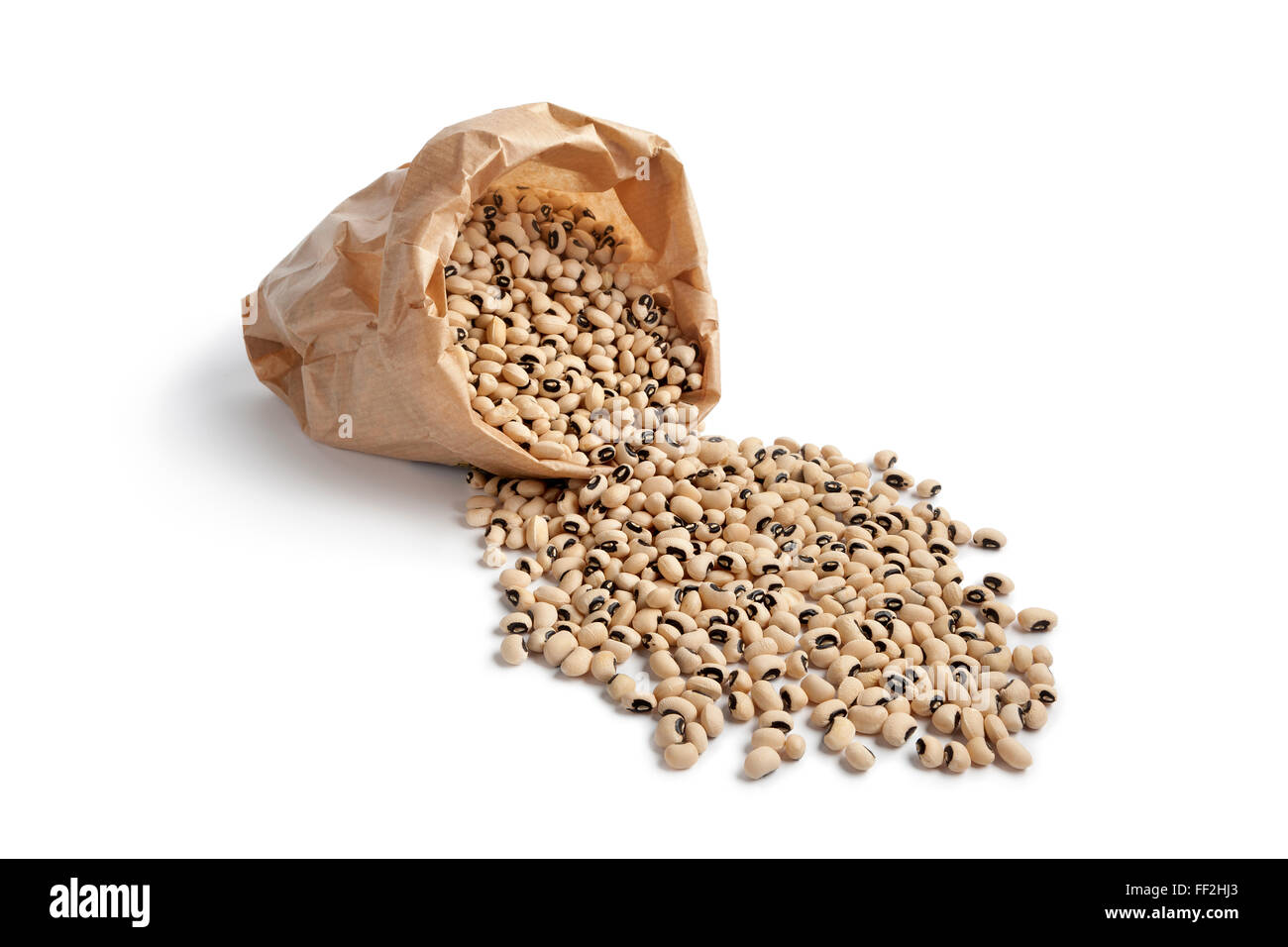 Dried black eyed peas in a paper sac on white background Stock Photo ...