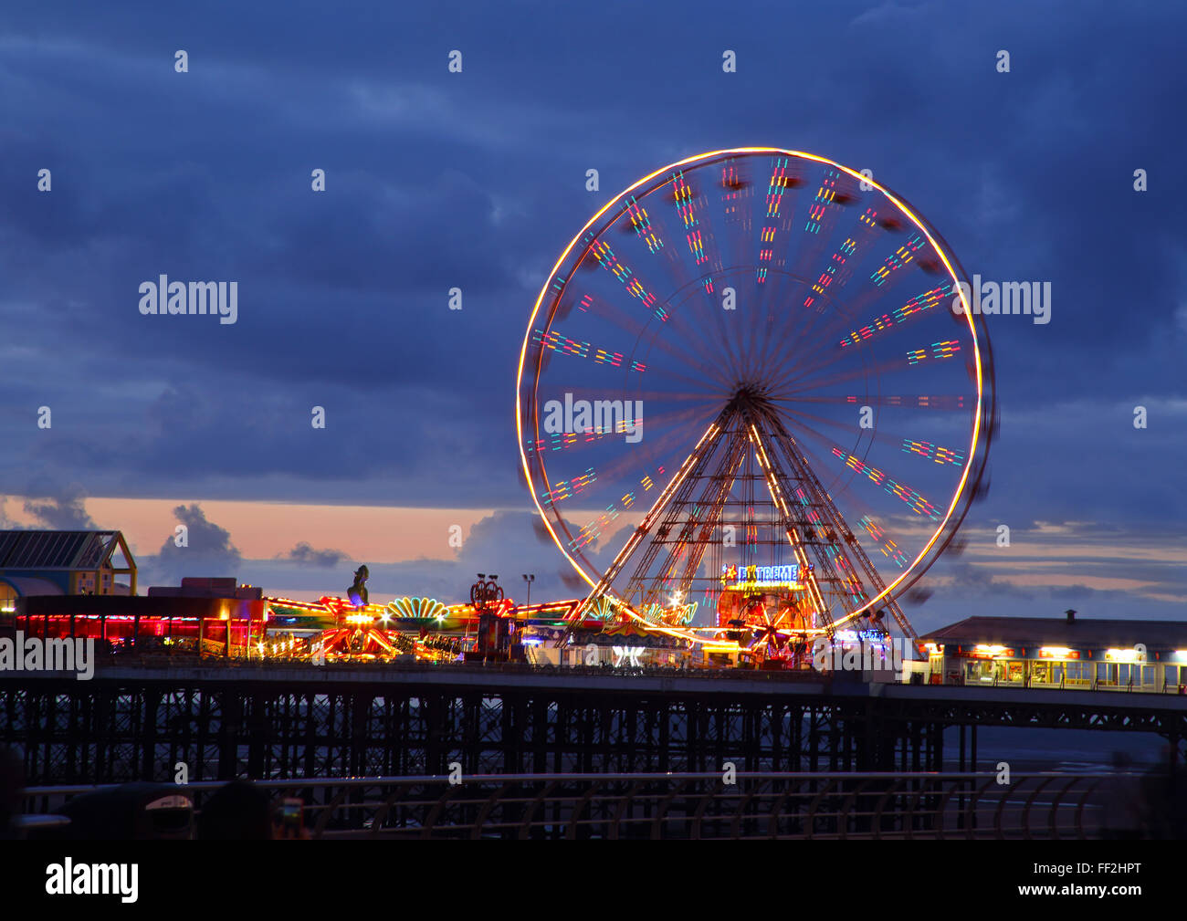 Big wheeRM and funfair on CentraRM Pier RMit at dusk, BRMackpooRM ...