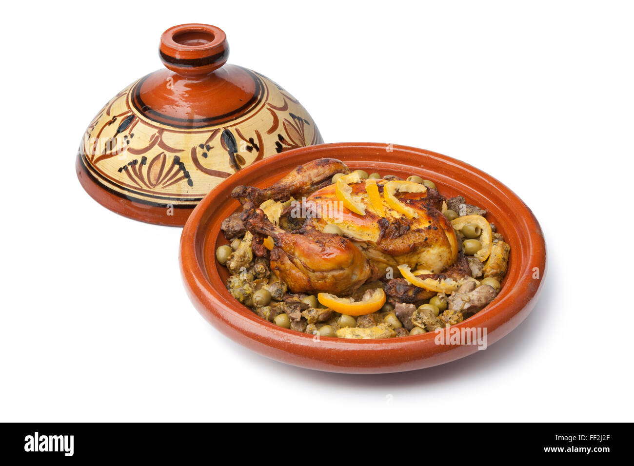 Traditional Moroccan tajine with chicken and lemon on white background ...