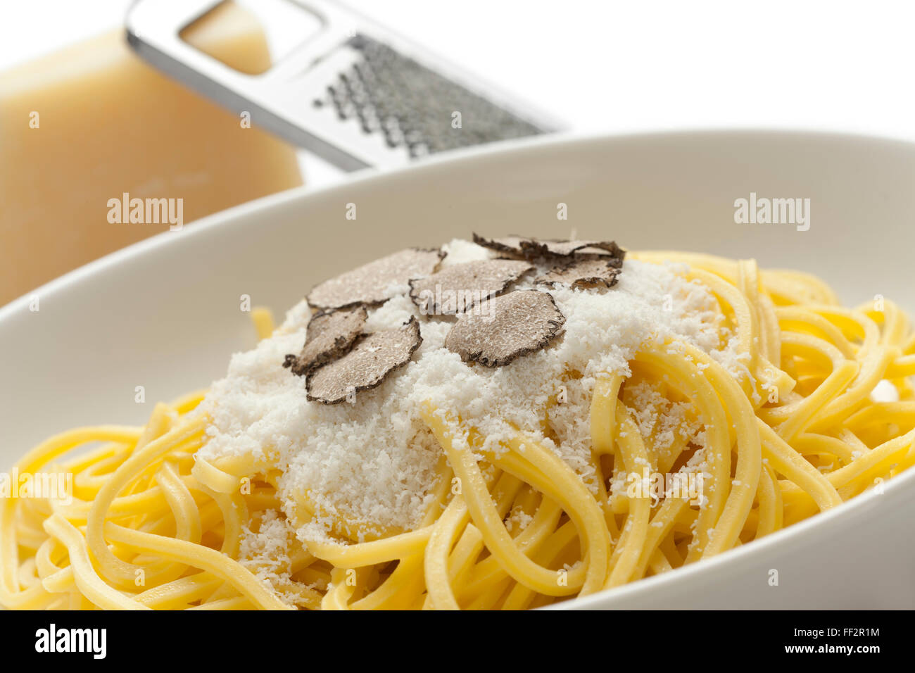 Spaghetti with black winter truffle and Parmesan cheese on a dish Stock ...