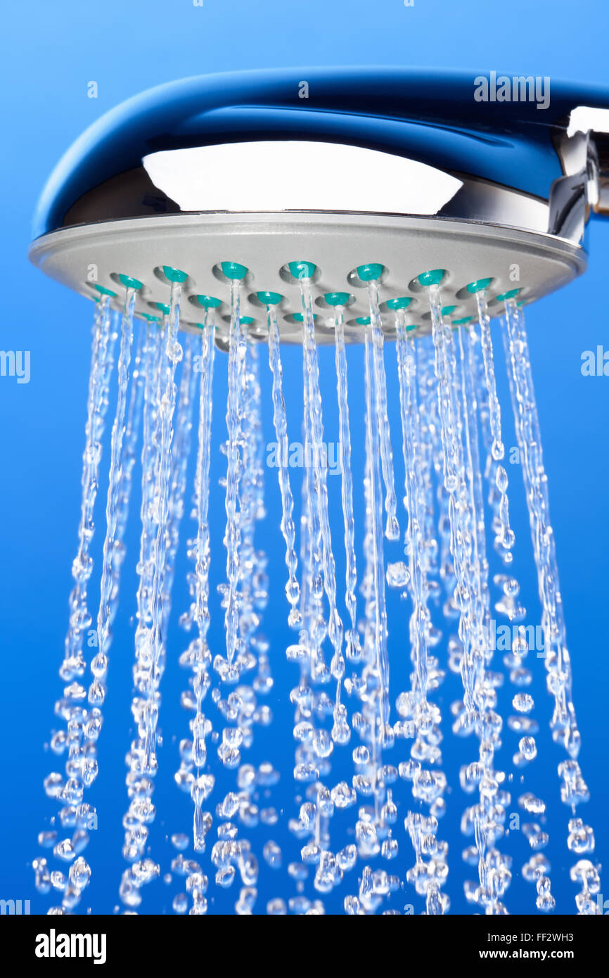 Shower with falling drops of water on the blue background Stock Photo ...