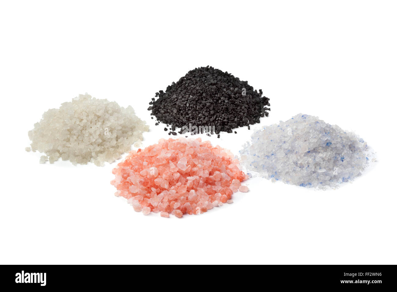 Variation of four types of salt on white background Stock Photo - Alamy