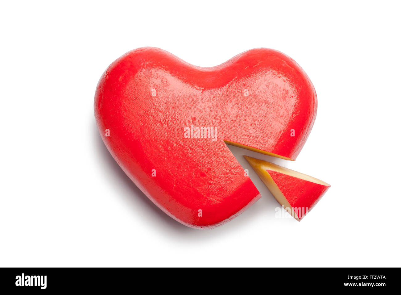 Heart shaped Gouda cheese on white background Stock Photo - Alamy