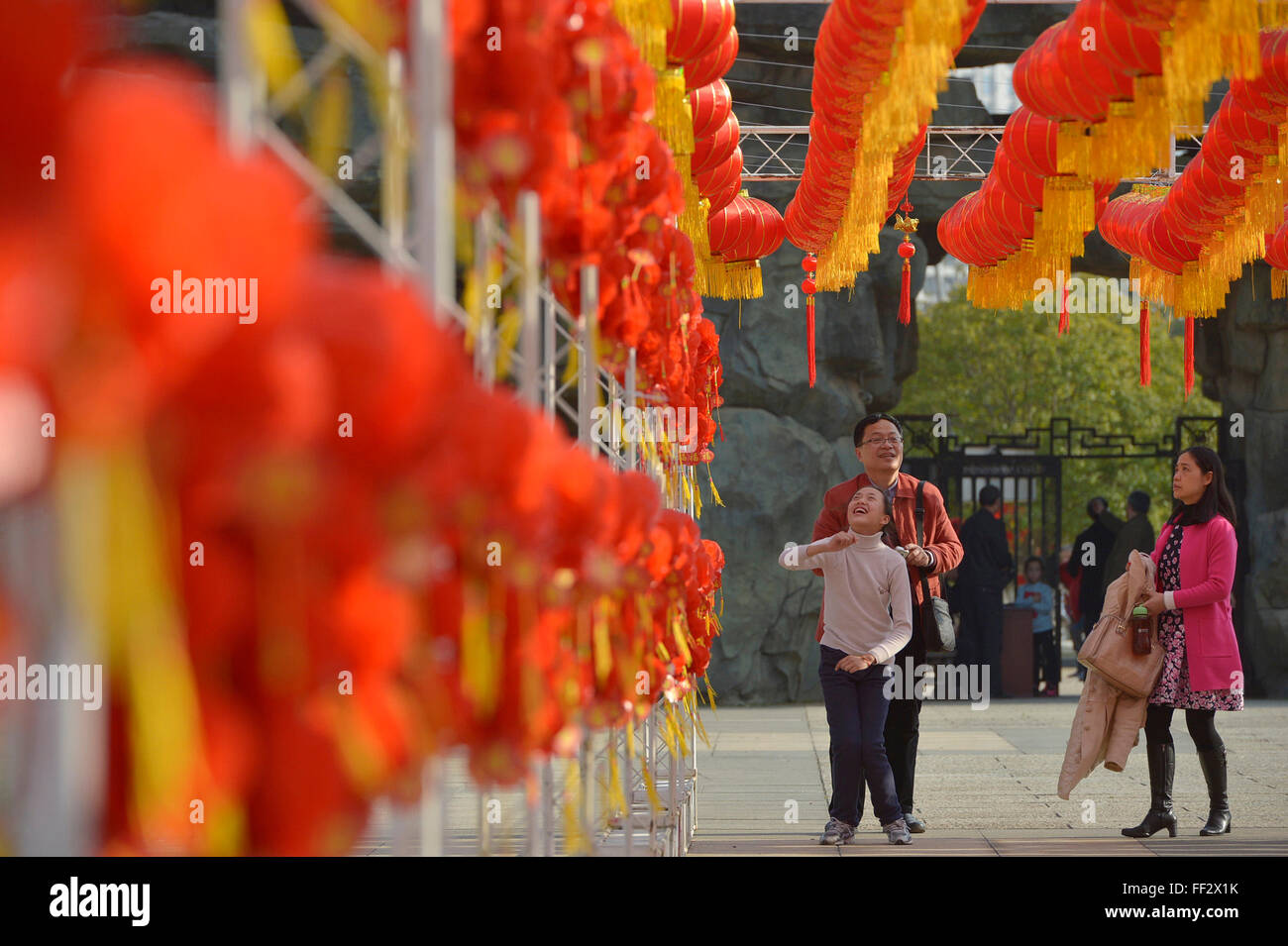 Nanchang, China's Jiangxi Province. 10th Feb, 2016. People take a ...