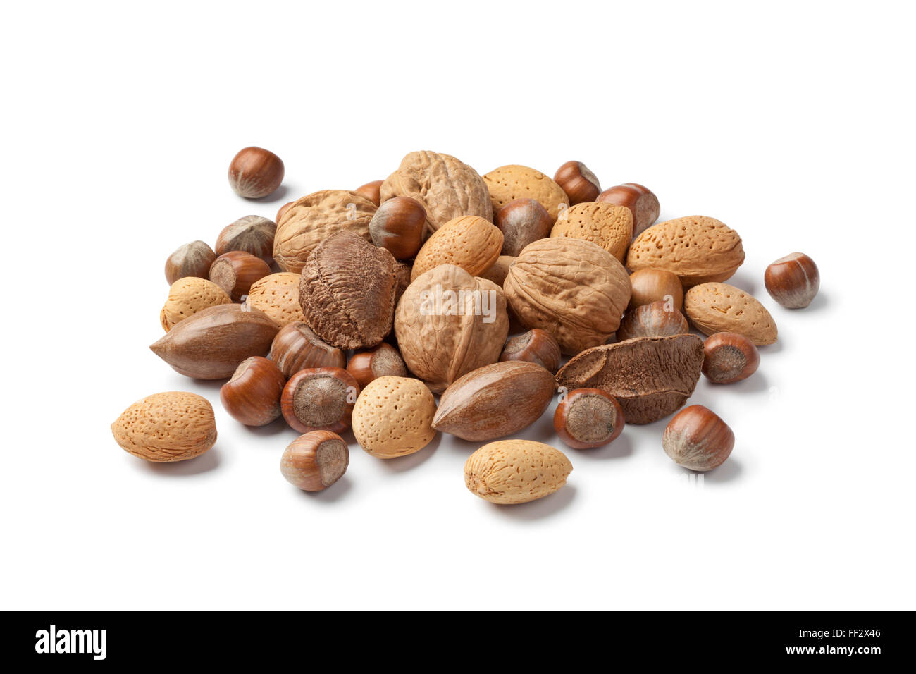 Heap of mixed nuts in the shell on white background Stock Photo - Alamy