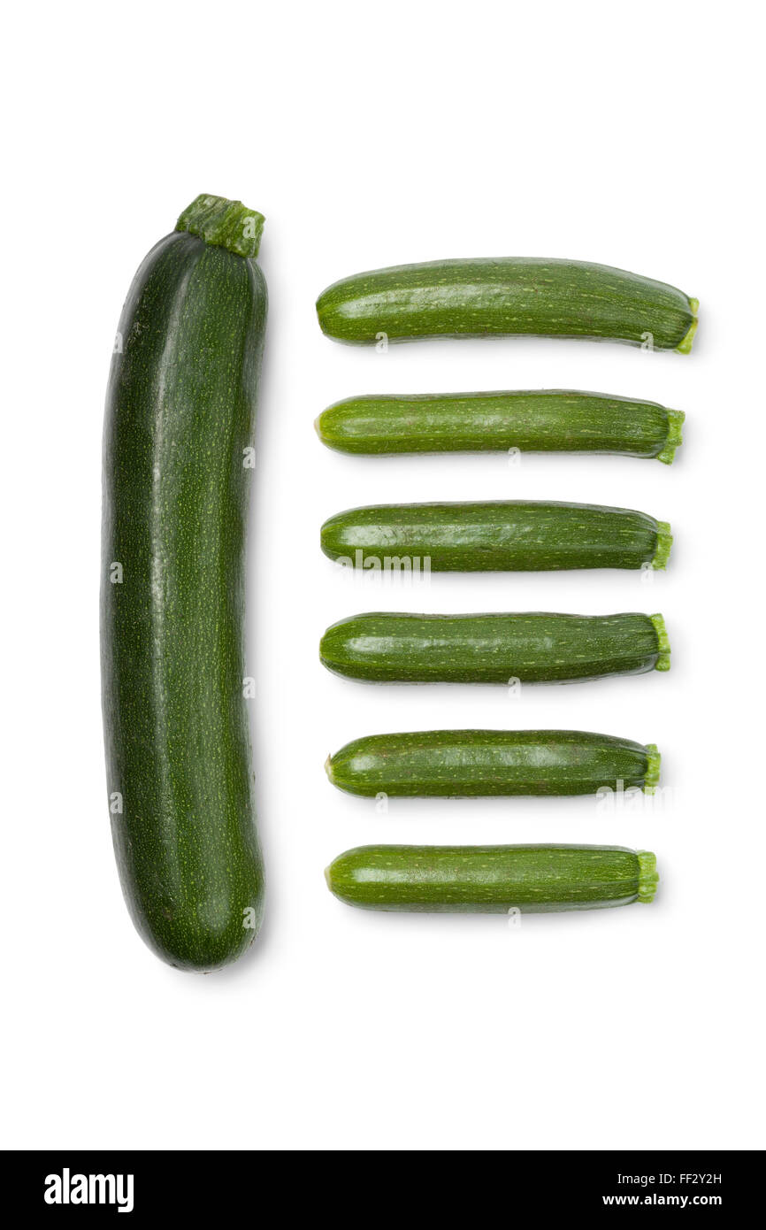 Fresh raw courgette and mini courgettes on white background Stock Photo ...