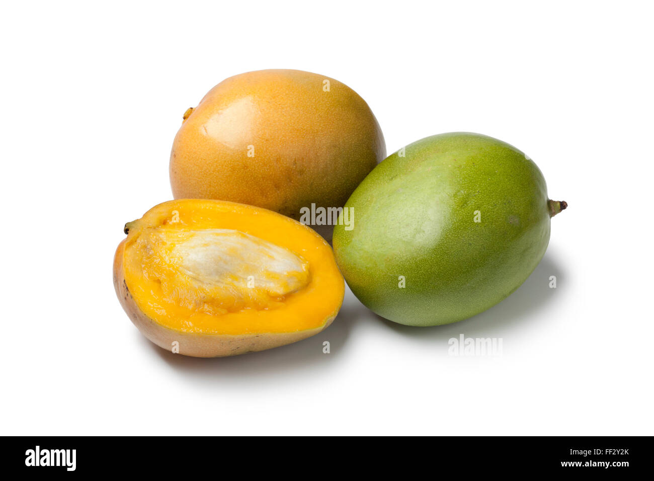 Fresh ripe whole and half Mango on white background Stock Photo - Alamy