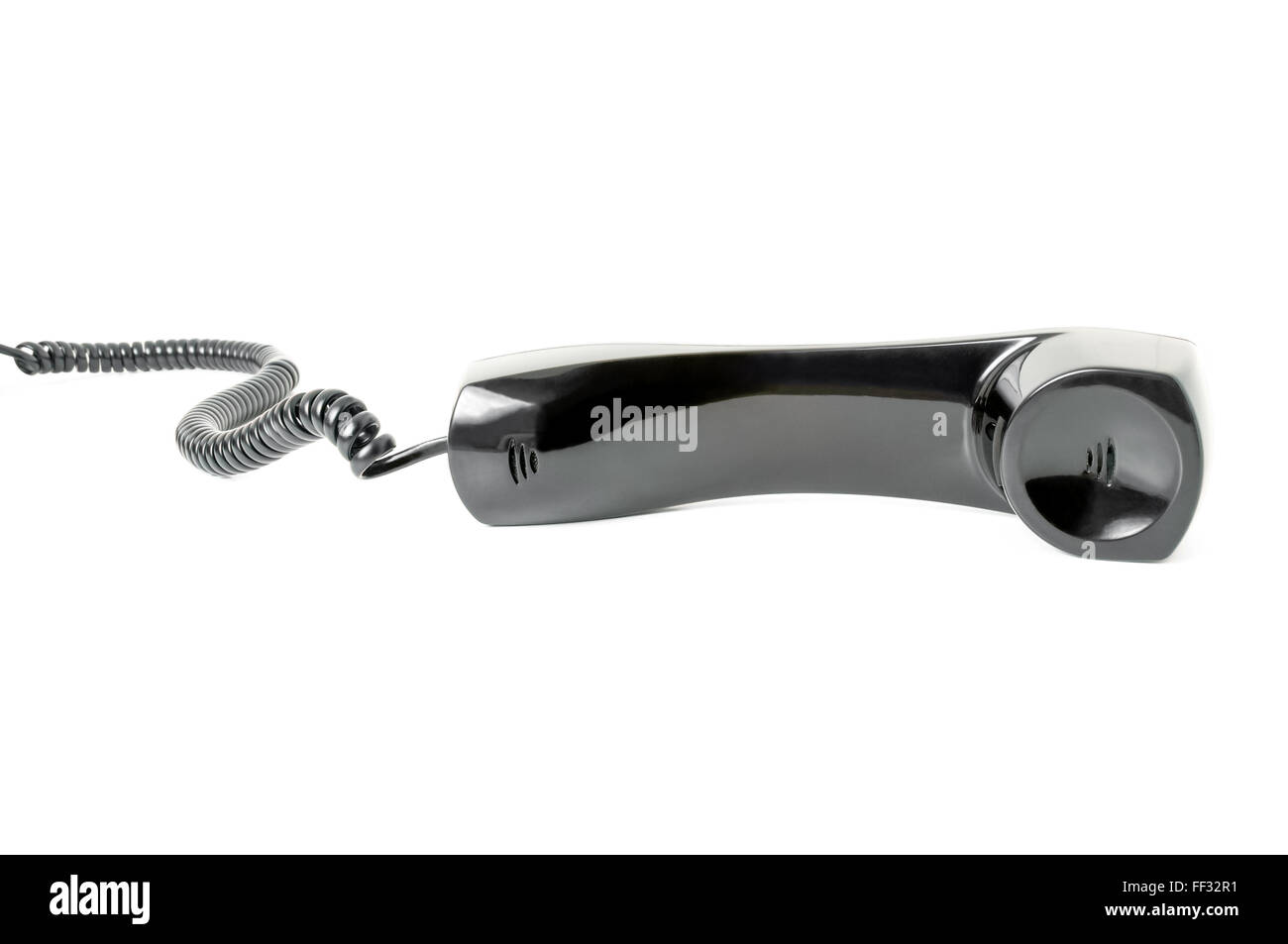 Modern black business phone receiver isolated on a white background ...