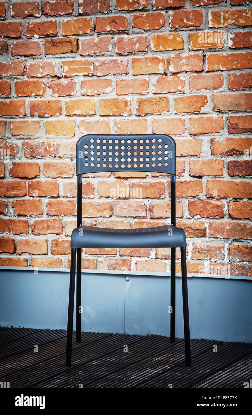 Metal chairs brick wall hi-res stock photography and images - Alamy
