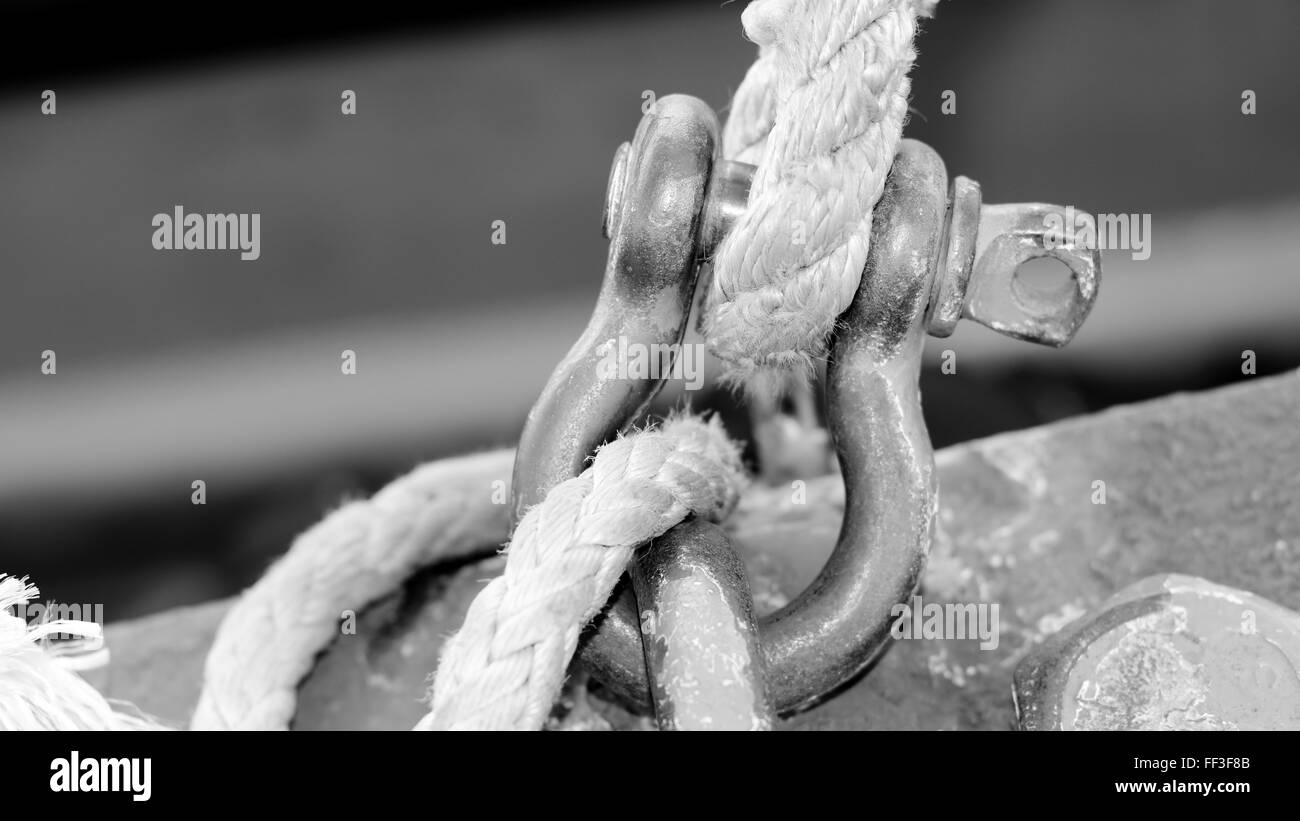 chipped paint on a shackle connected with nylon rope Stock Photo - Alamy