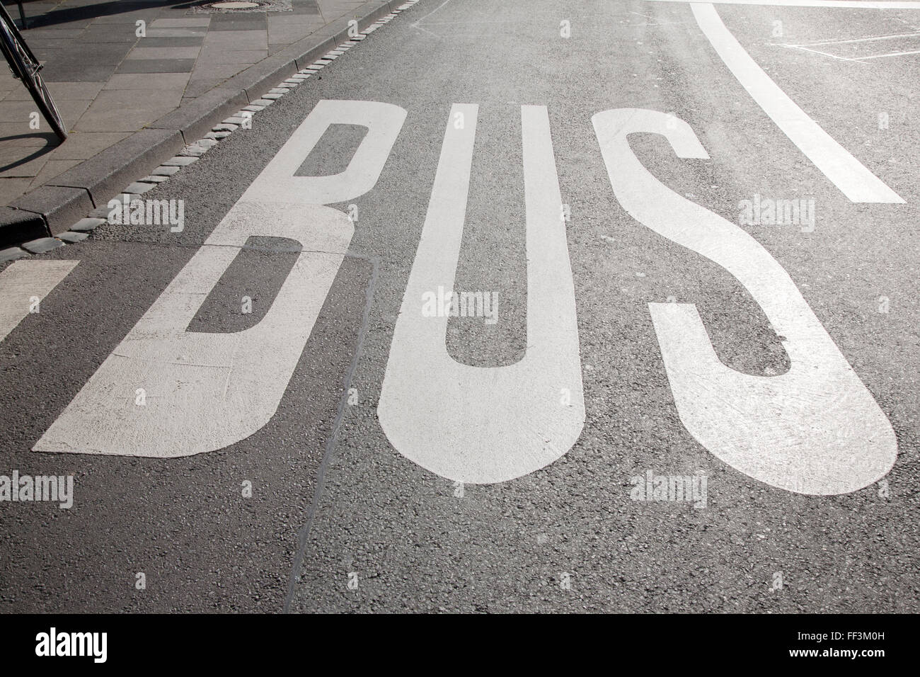 Bus Lane Sign on Street Surface Stock Photo - Alamy