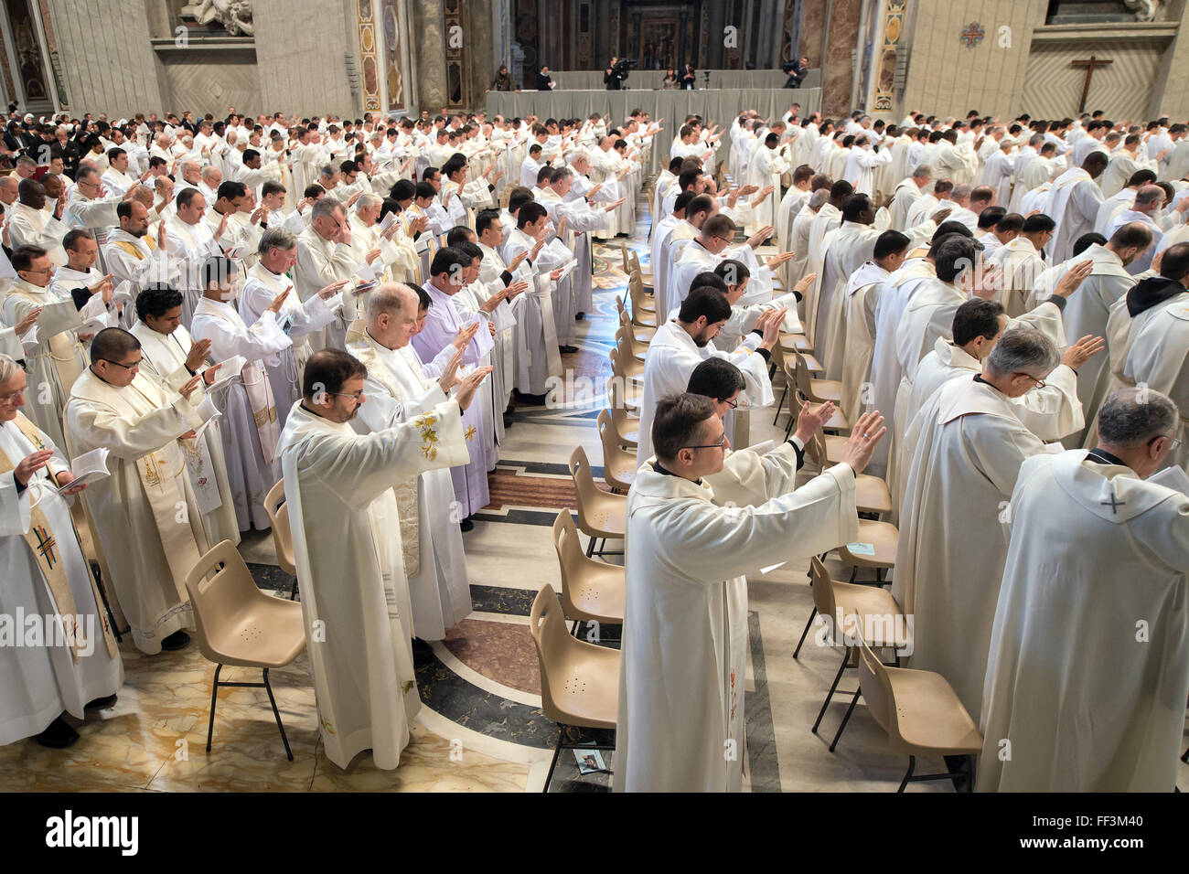 Priests attend the Chrism Mass in St. Peter's Basilica. Preti. Messa ...