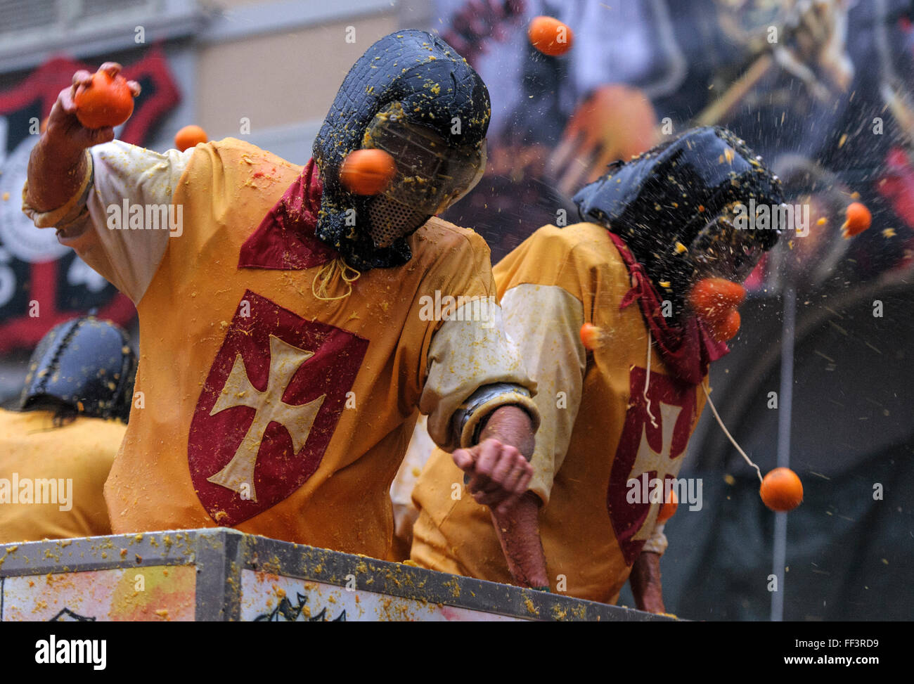 Ivrea, Italy. 09th Feb, 2016. Orange thrower on cart fights during the ...