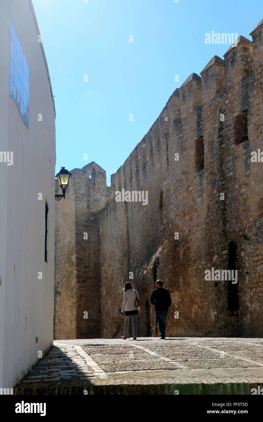 Historic street and castle walls in the village of Vejer de la Frontera ...