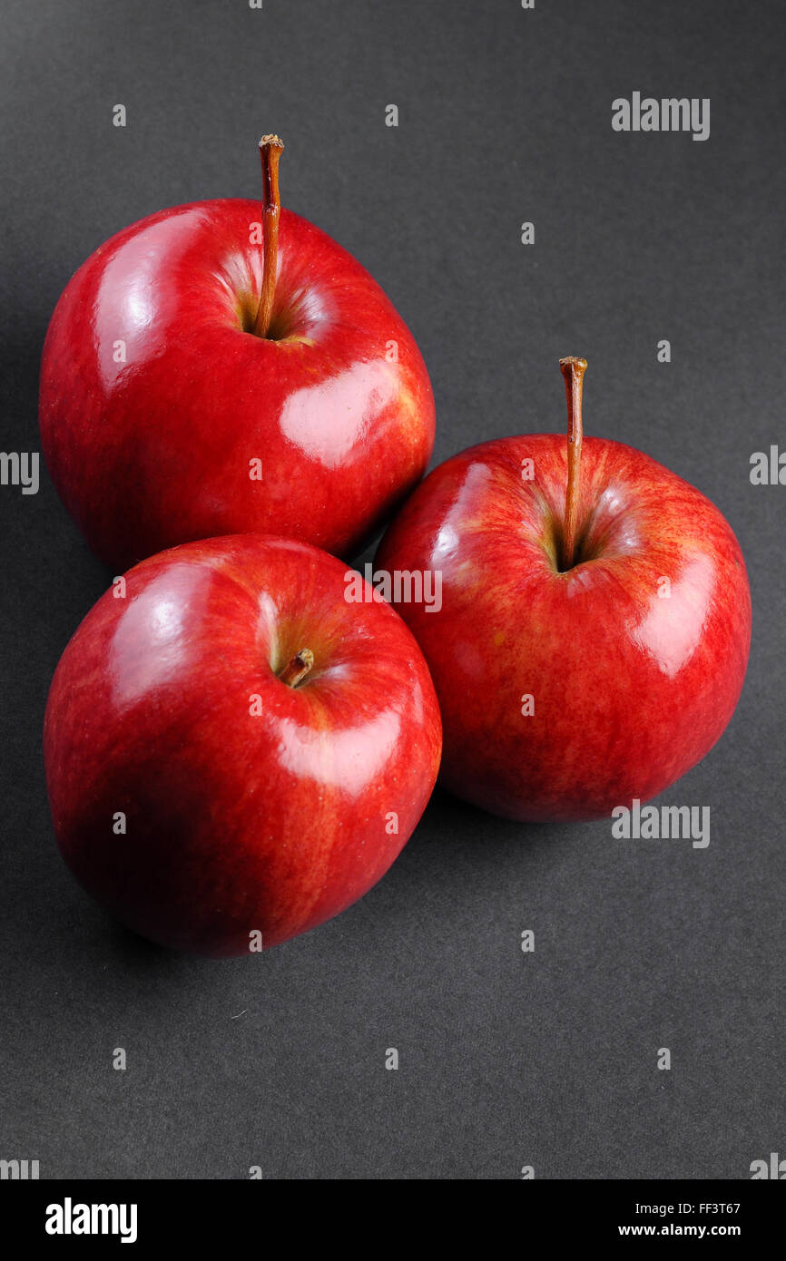 Red apples on white and black background Stock Photo - Alamy