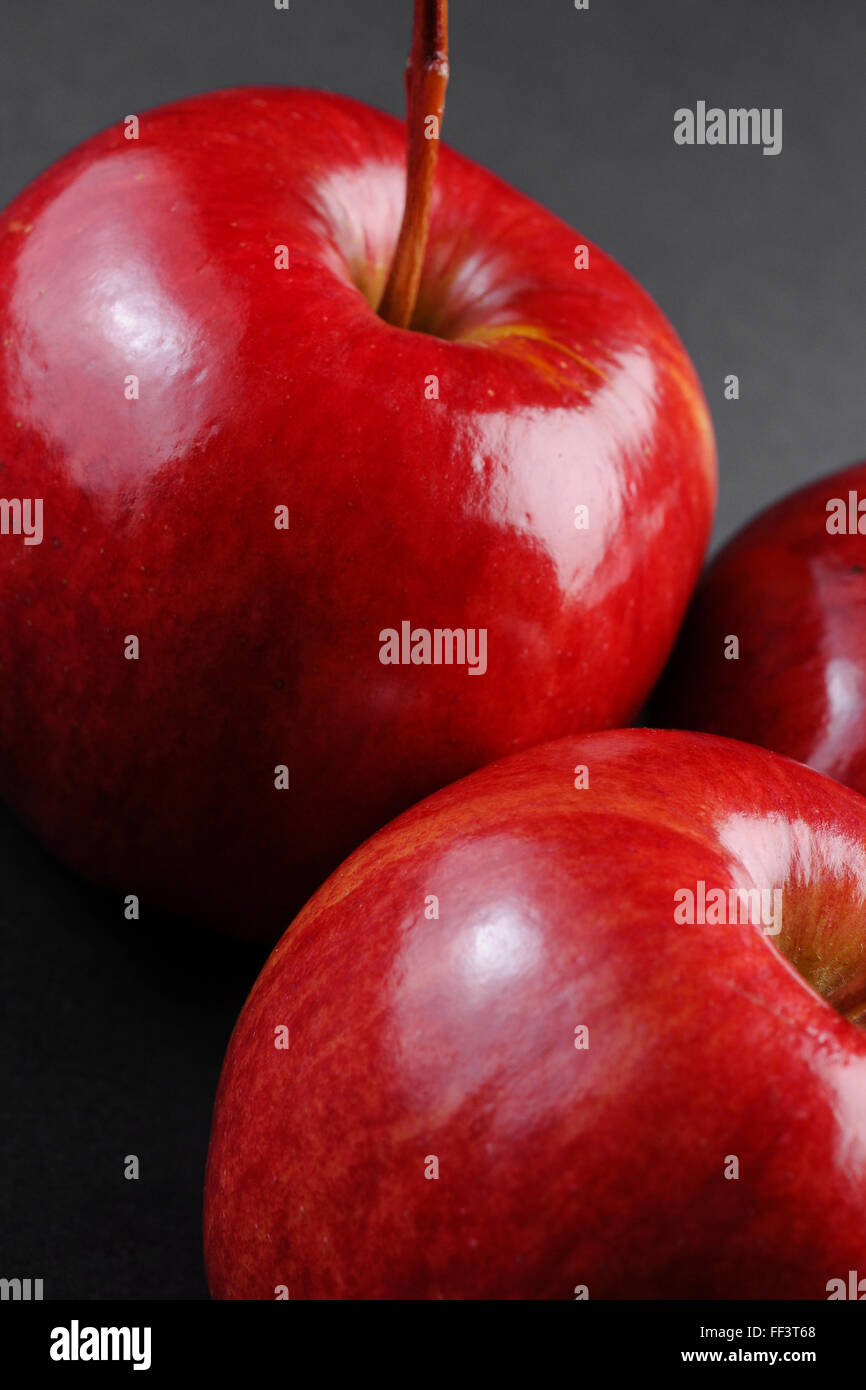 Red apples on white and black background Stock Photo - Alamy