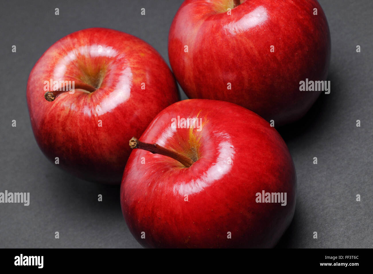 Red apples on white and black background Stock Photo - Alamy