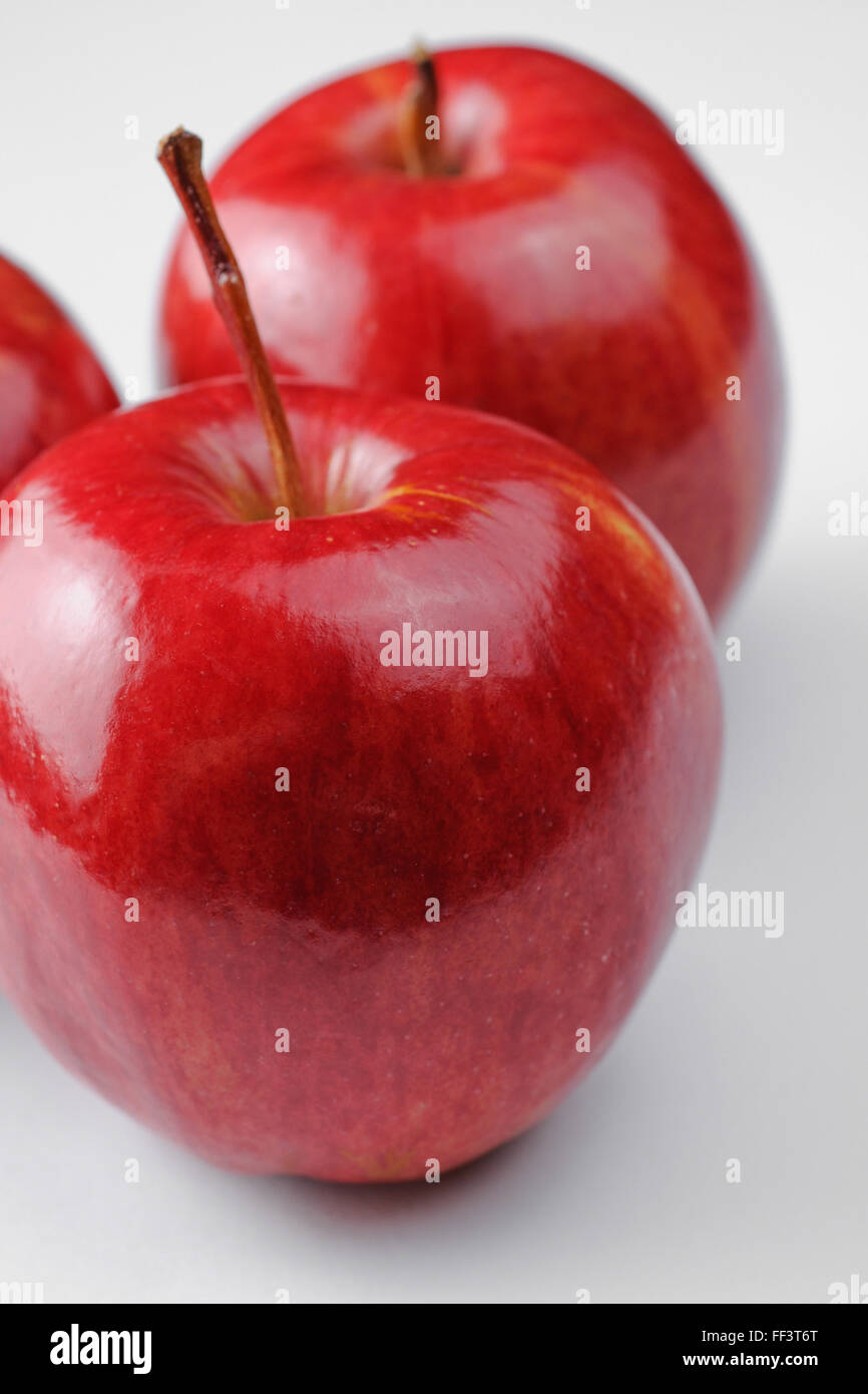 Red apples on white and black background Stock Photo - Alamy